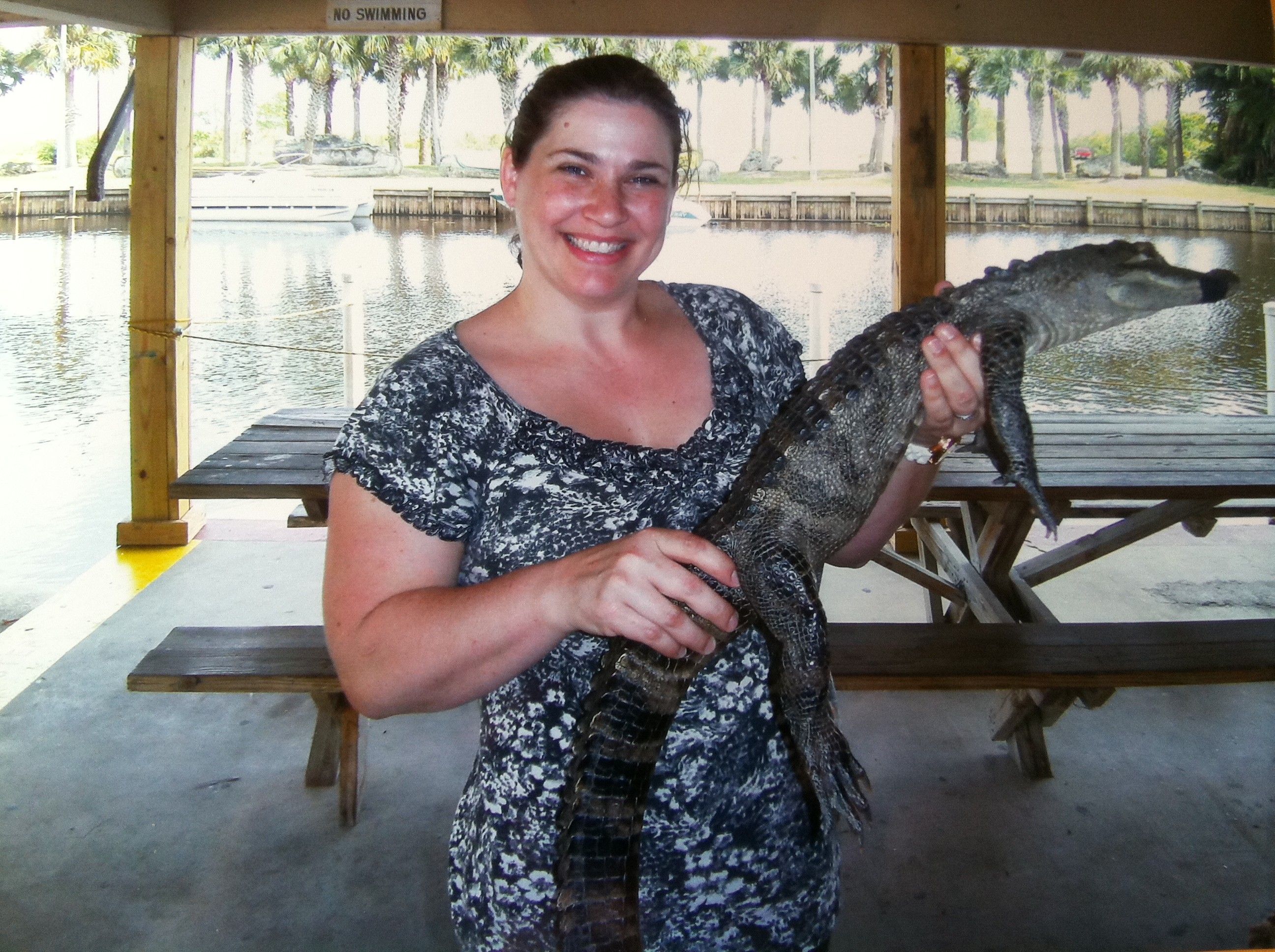 Woman Holding Baby Gator too - A Day in Motherhood